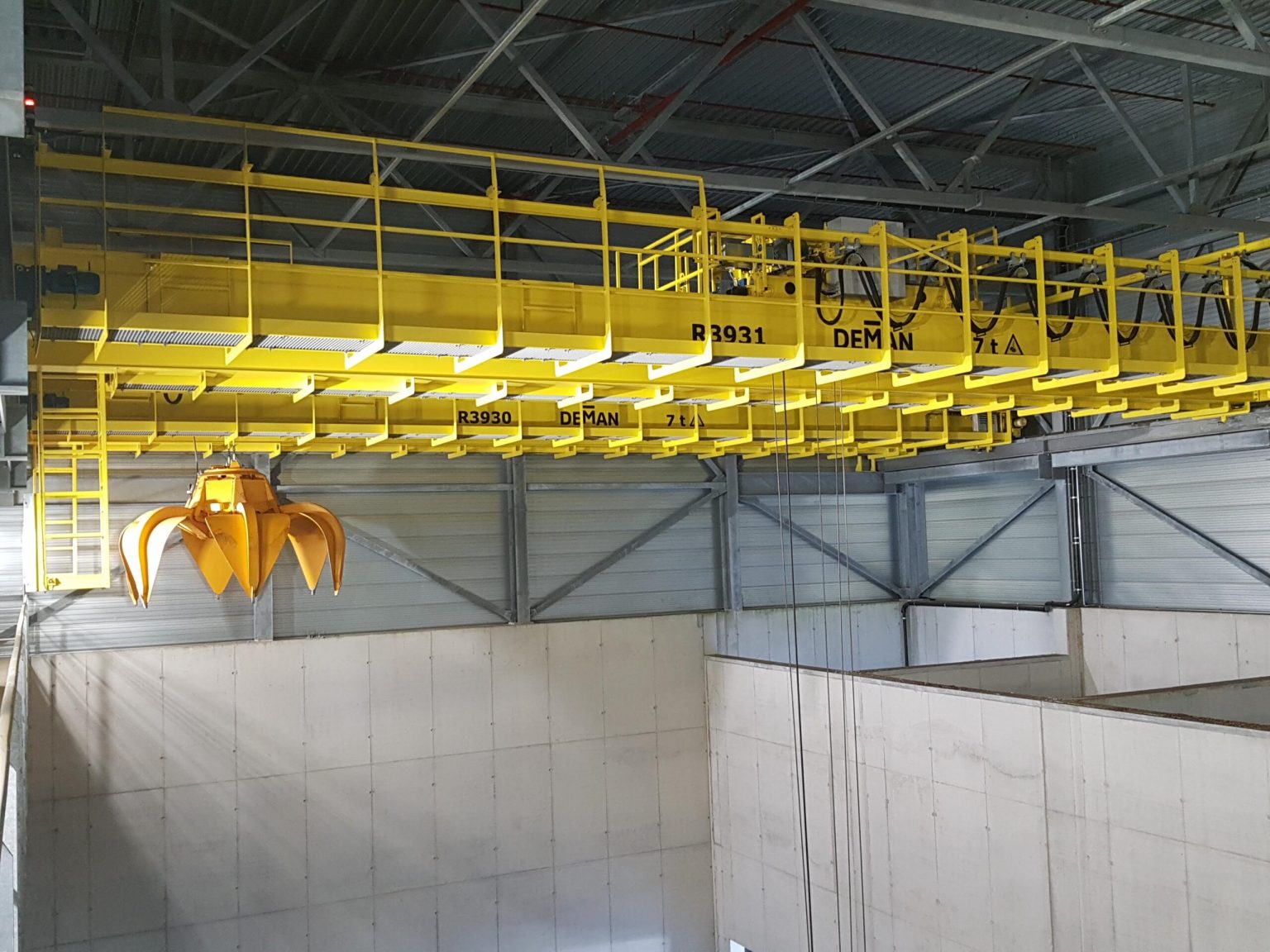 Automatisatie rolbruggen met grijper voor biomassacentrale - Actemium BE